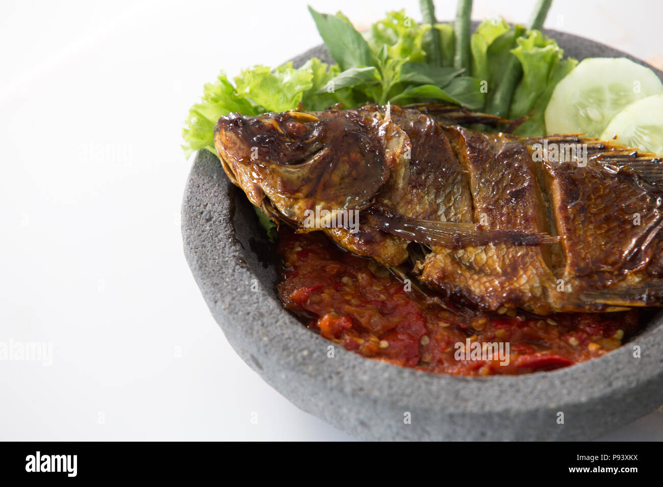 penyetan traditional indonesian food with fish served with spicy sambal ...