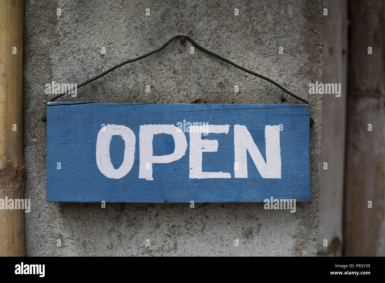 Blue white open sign hanging hi-res stock photography and images - Alamy