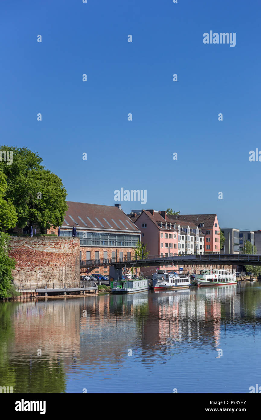 Colorful buildings and ships at the Fulda river quay in Kassel, Germany ...