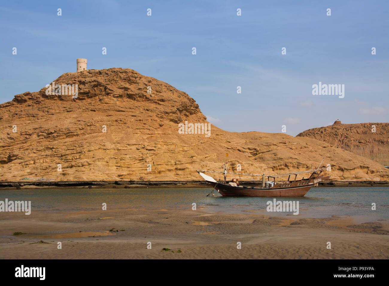 OMAN, Ash Sharqiyah Region, Sur, boats on the beach with Tower of Al ...