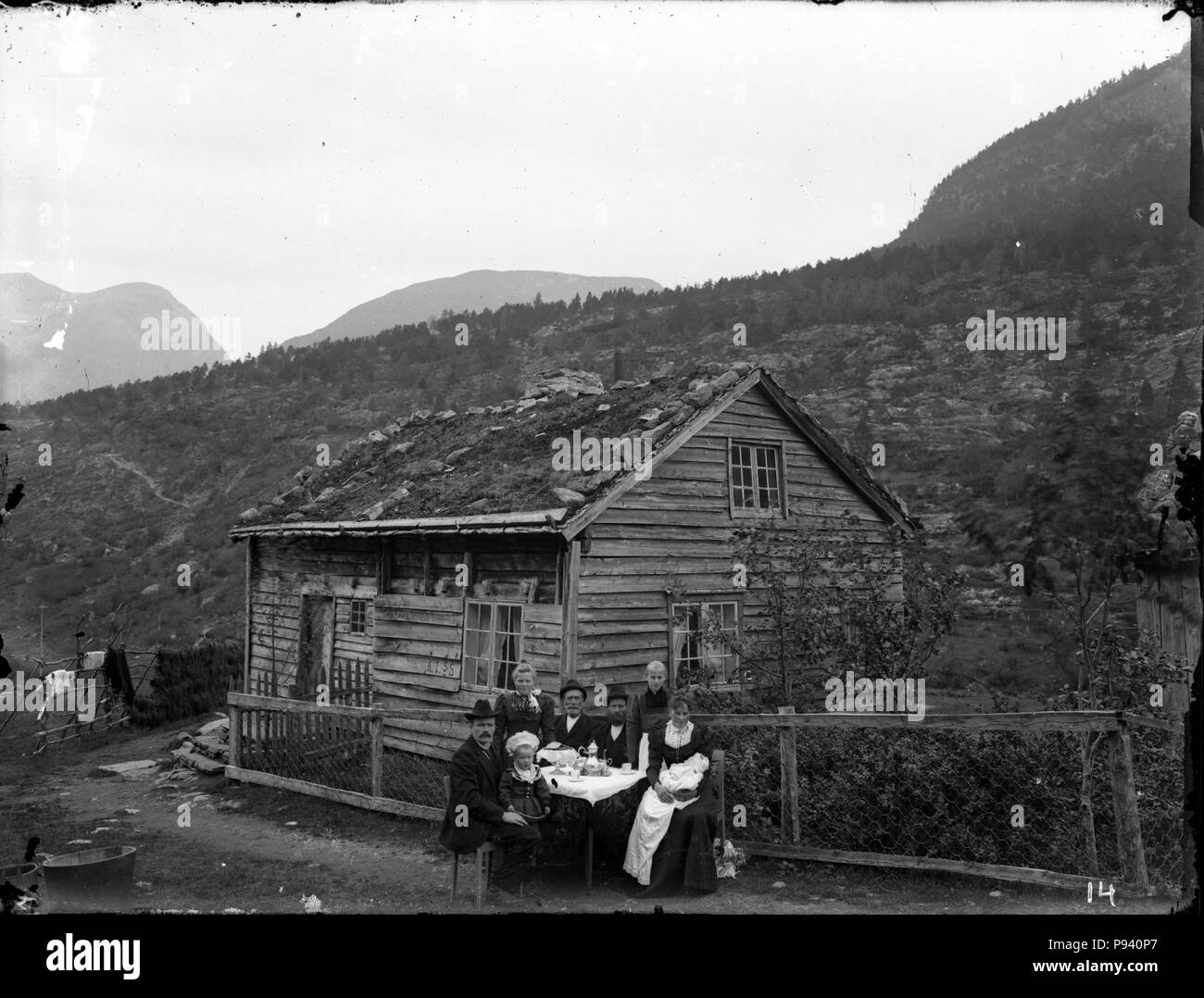 A family outside their home Stock Photo - Alamy