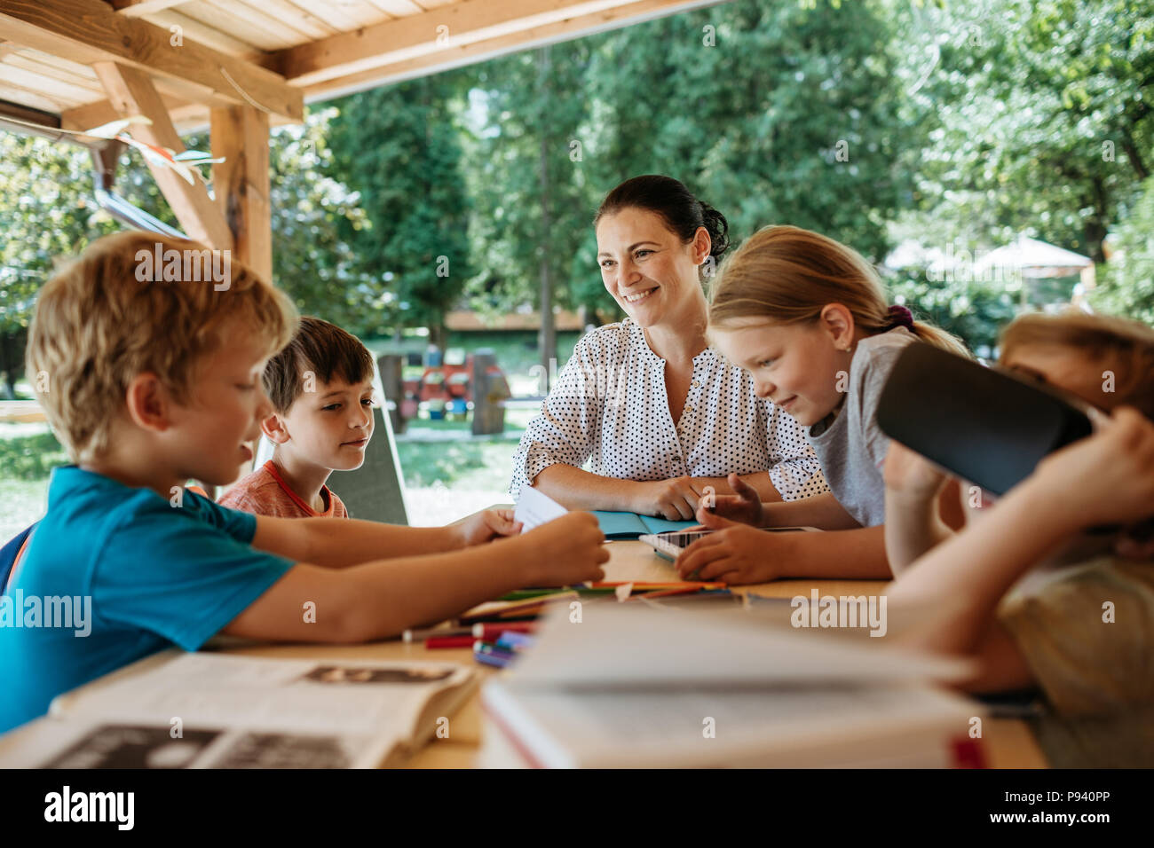 Group of young schoolchildren having a lesson. Children learning ...