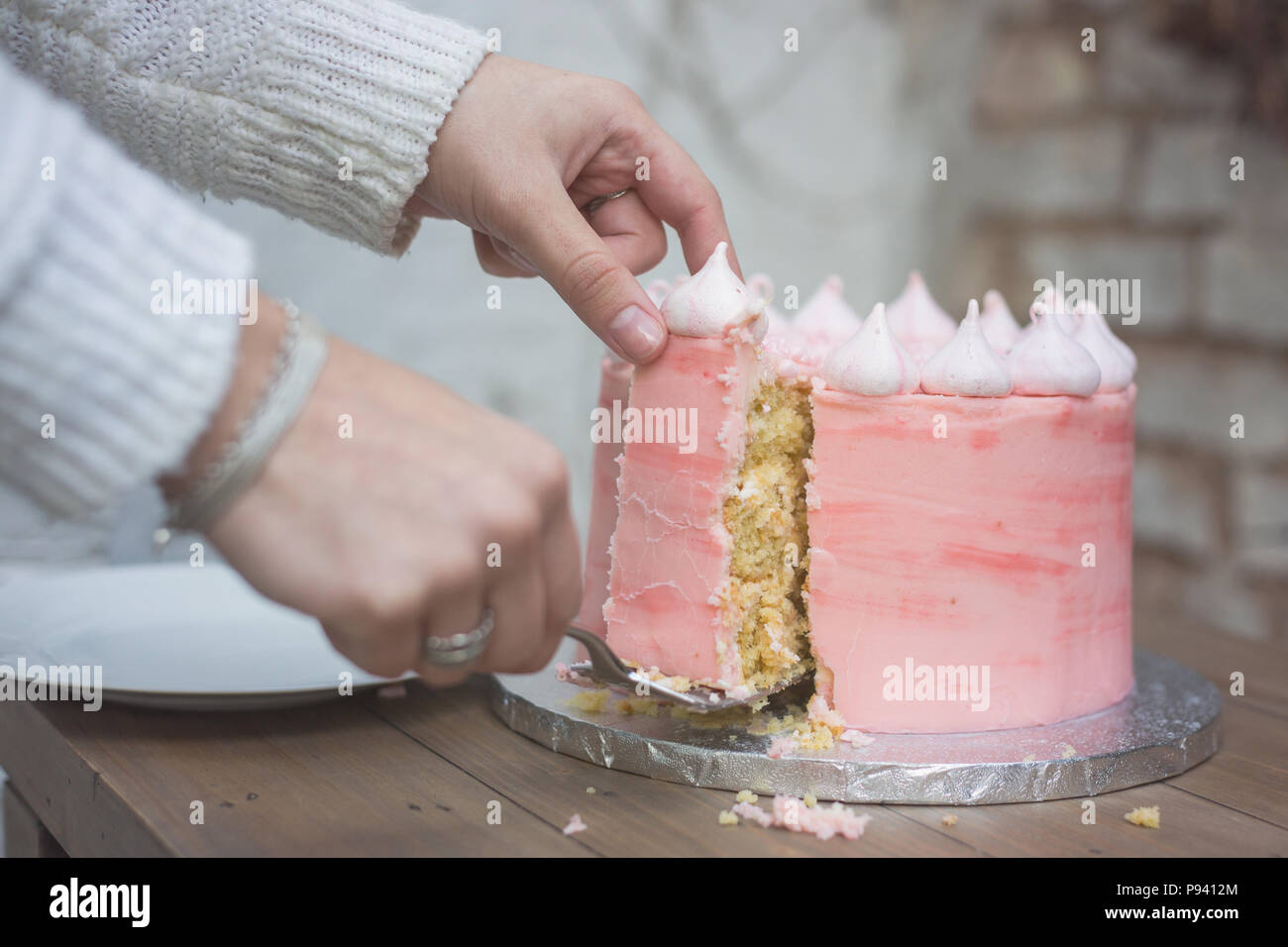 Pink Champagne Cake with mini pink meringues on top, covered with ...