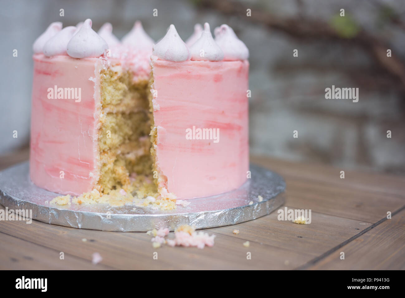 Pink Champagne Cake with mini pink meringues on top, covered with ...