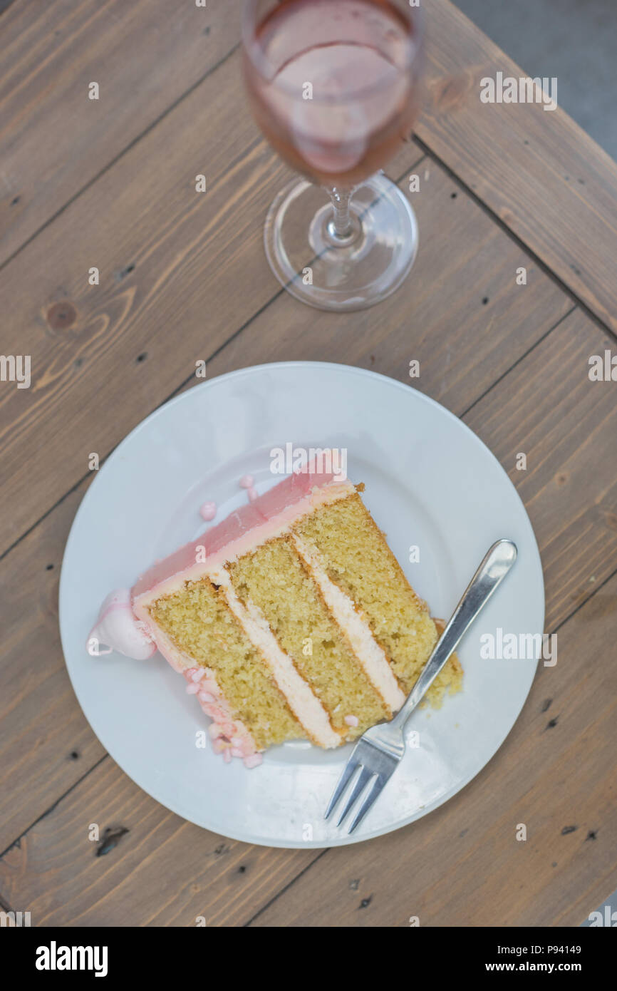 Pink Champagne Cake with mini pink meringues on top, covered with ...