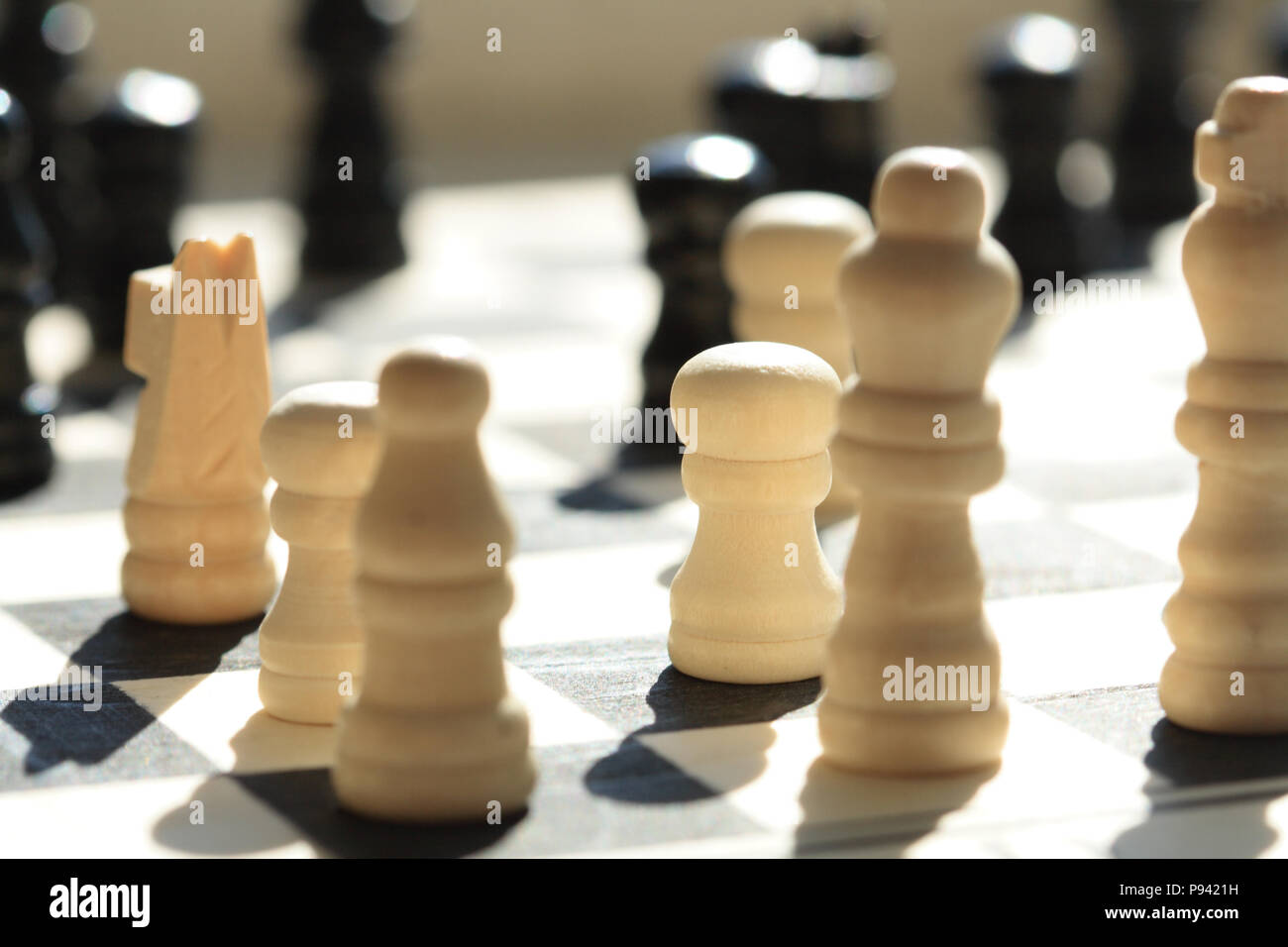 A game of chess in progress. Focus is on the white single pawn Stock ...