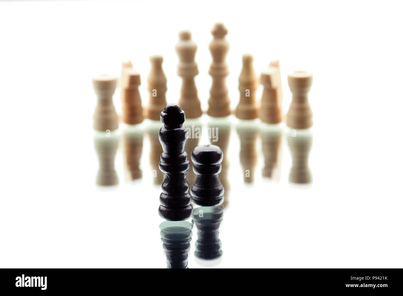 Black Chess King and single pawn against white chess army on white ...