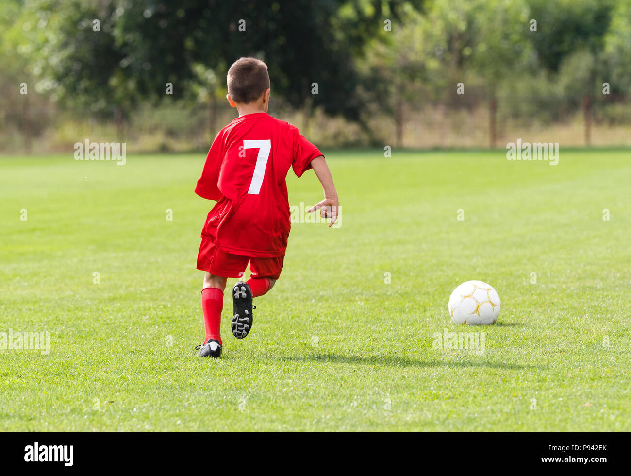 Little Boy Shooting at Goal Stock Photo - Alamy