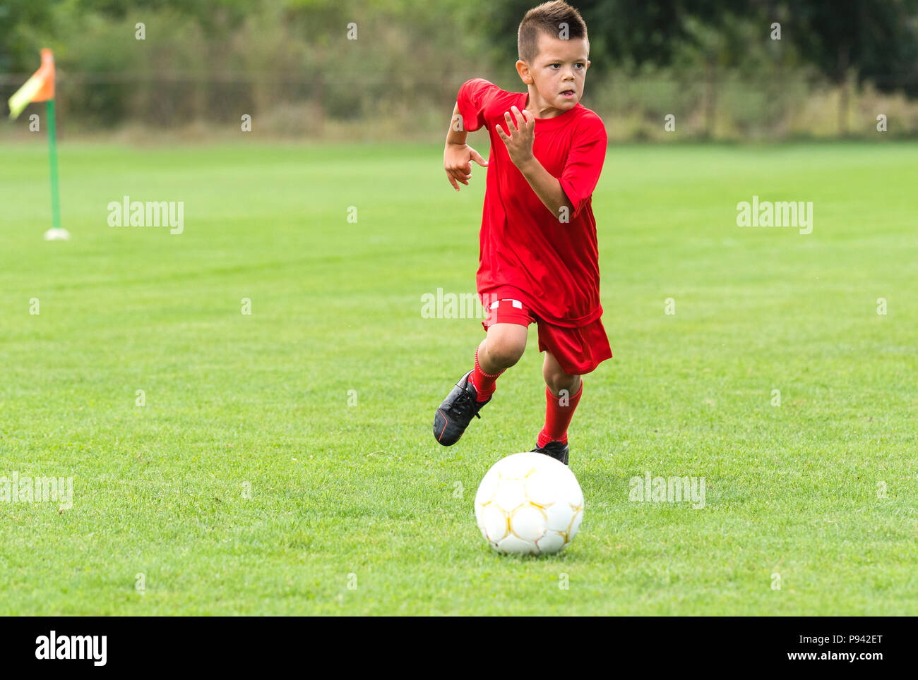 Little Boy Shooting at Goal Stock Photo - Alamy