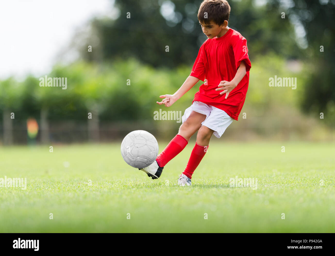 Little Boy Shooting at Goal Stock Photo - Alamy