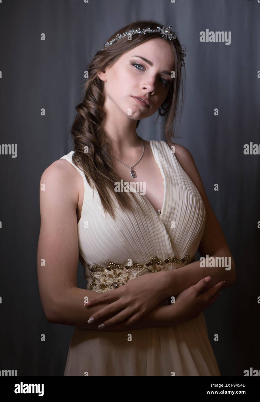 Summer portrait of young beautiful lady wearing long white evening ...