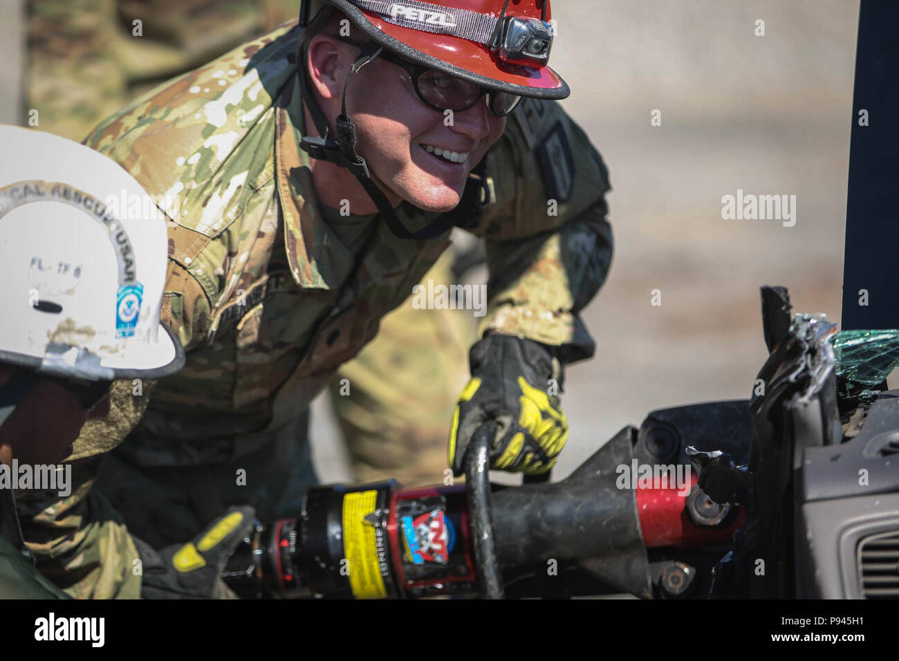 U.S. Army Spc. Ryan Dunnett, assigned to the 287th Engineer Detachment ...