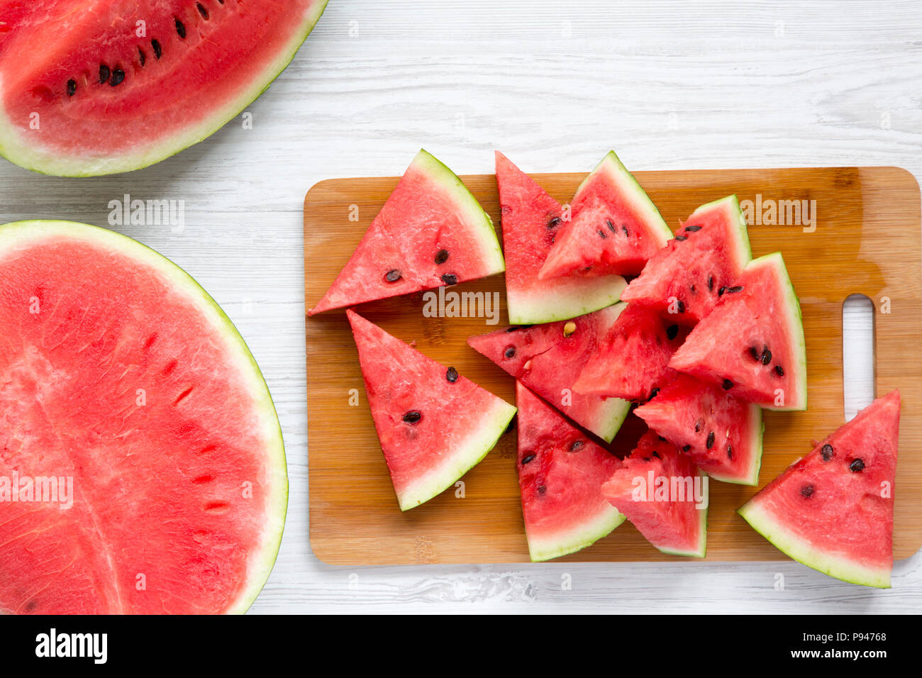 Chopped ripe juicy watermelon on bamboo board, top view. From above ...