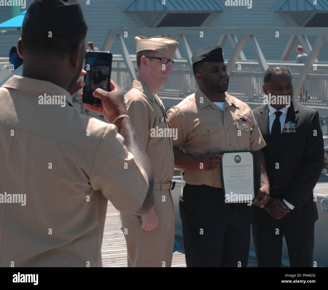 Lt(JG) Christopher Eastman (left) stands next to AO2(SW) Brandon Howard ...
