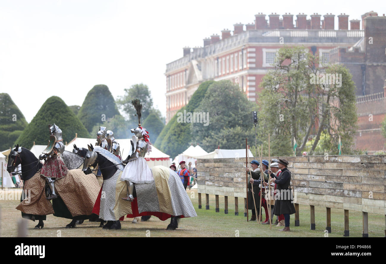 Knights line up in front of the Royal box before they joust in a ...