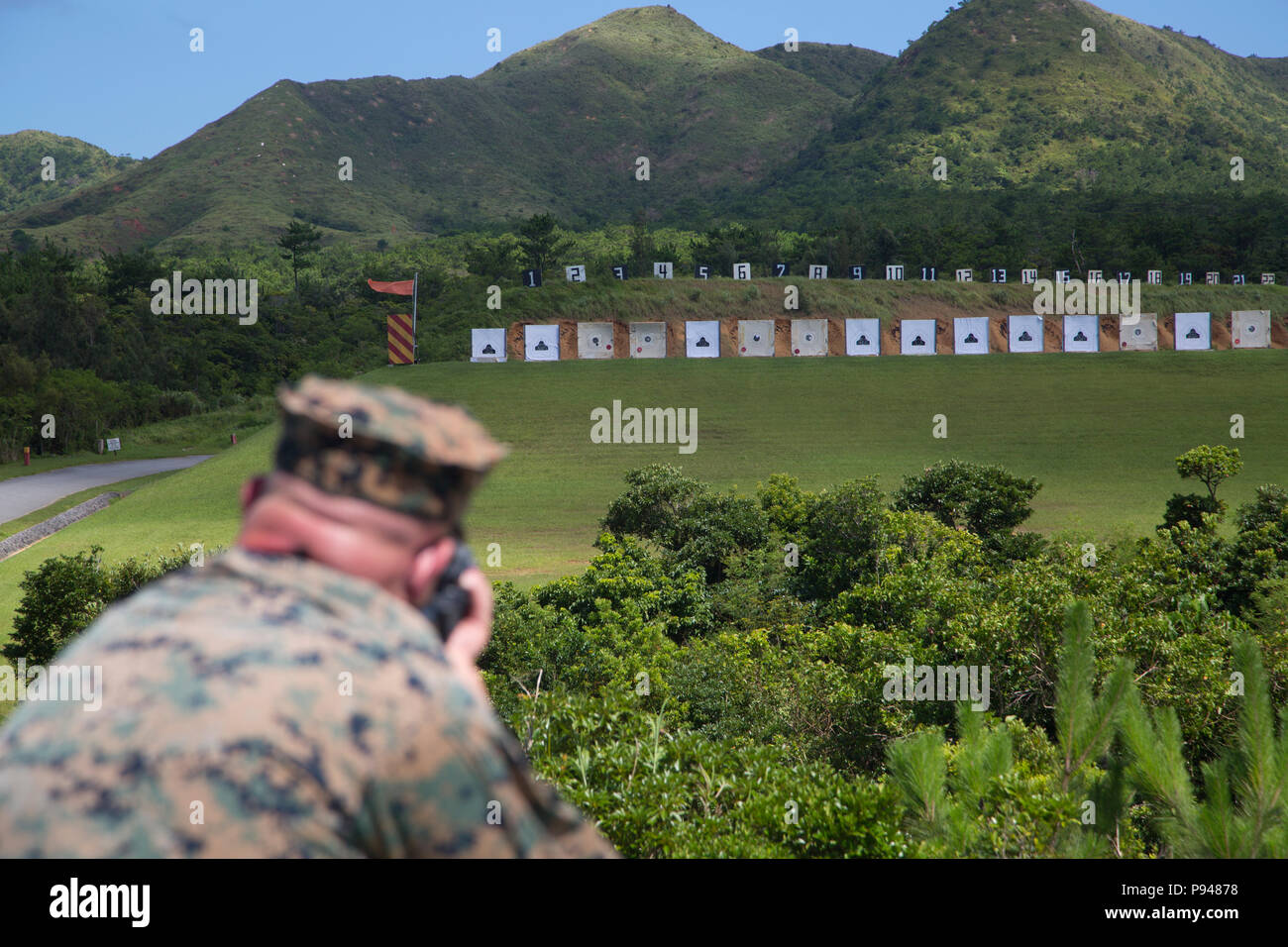 A U.S. Marine sights in during rifle qualification July 9 at the range ...