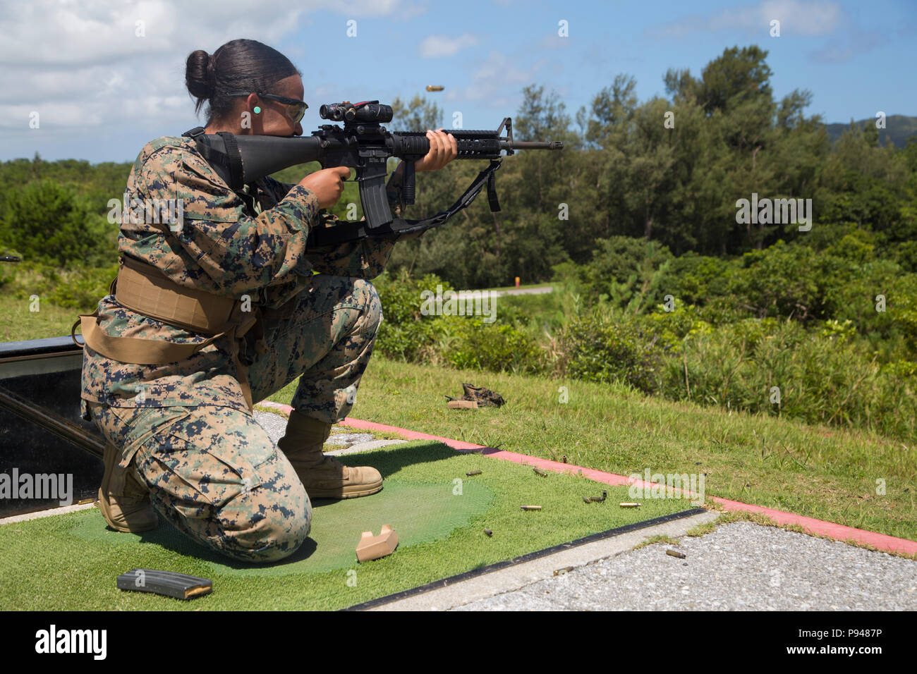 A U.S. Marine fires for rifle qualification July 9 at the range on Camp ...