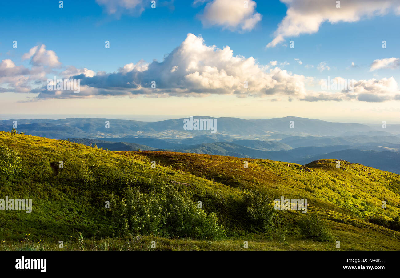 beautiful clouds over the summer mountain landscape. grassy hills and ...