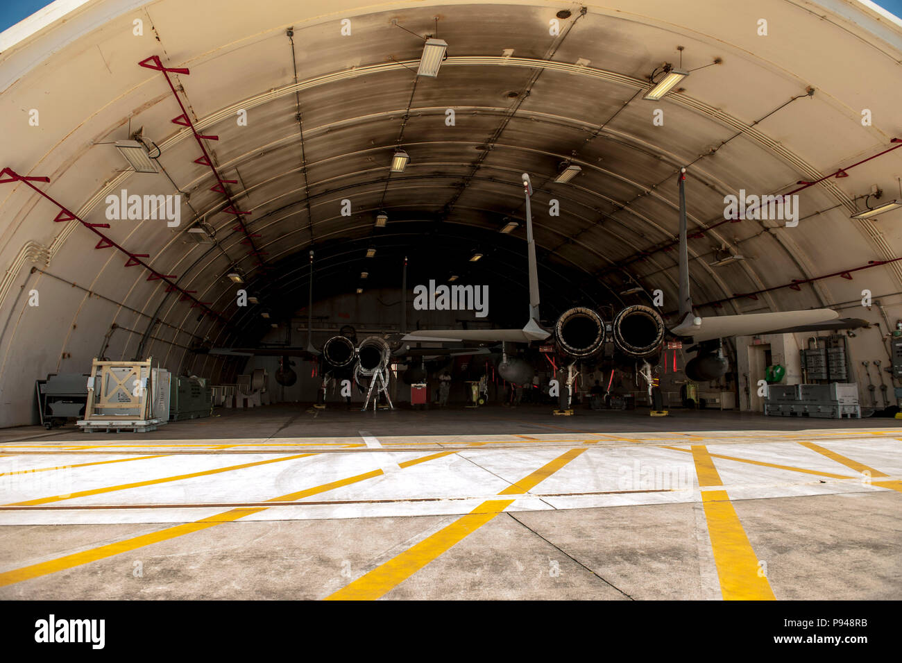 Jets sit in a protective aircraft shelter during preparation for ...