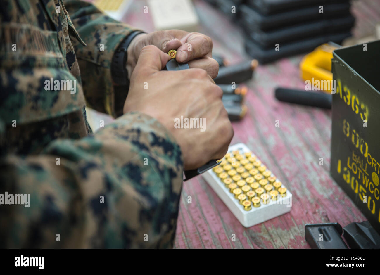 Military Police personnel load rounds into magazines during Parris ...