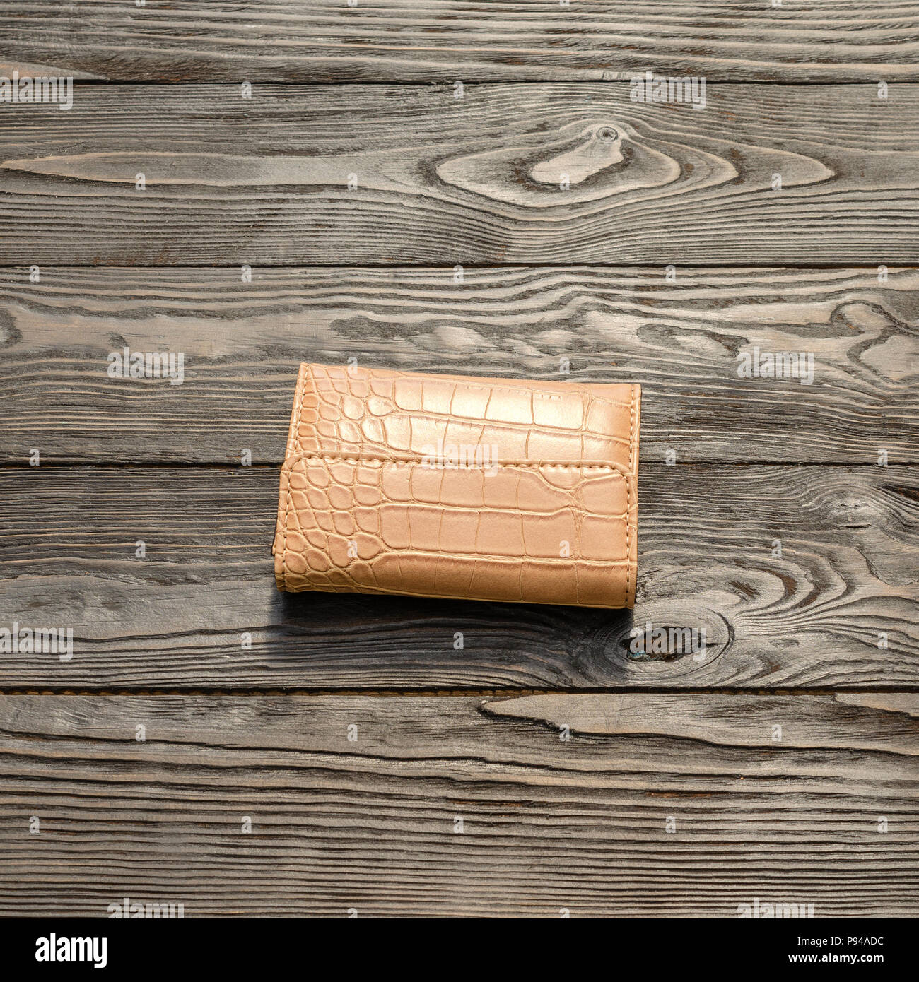 Brown leather elegance women's wallet on dark wooden background. For ...
