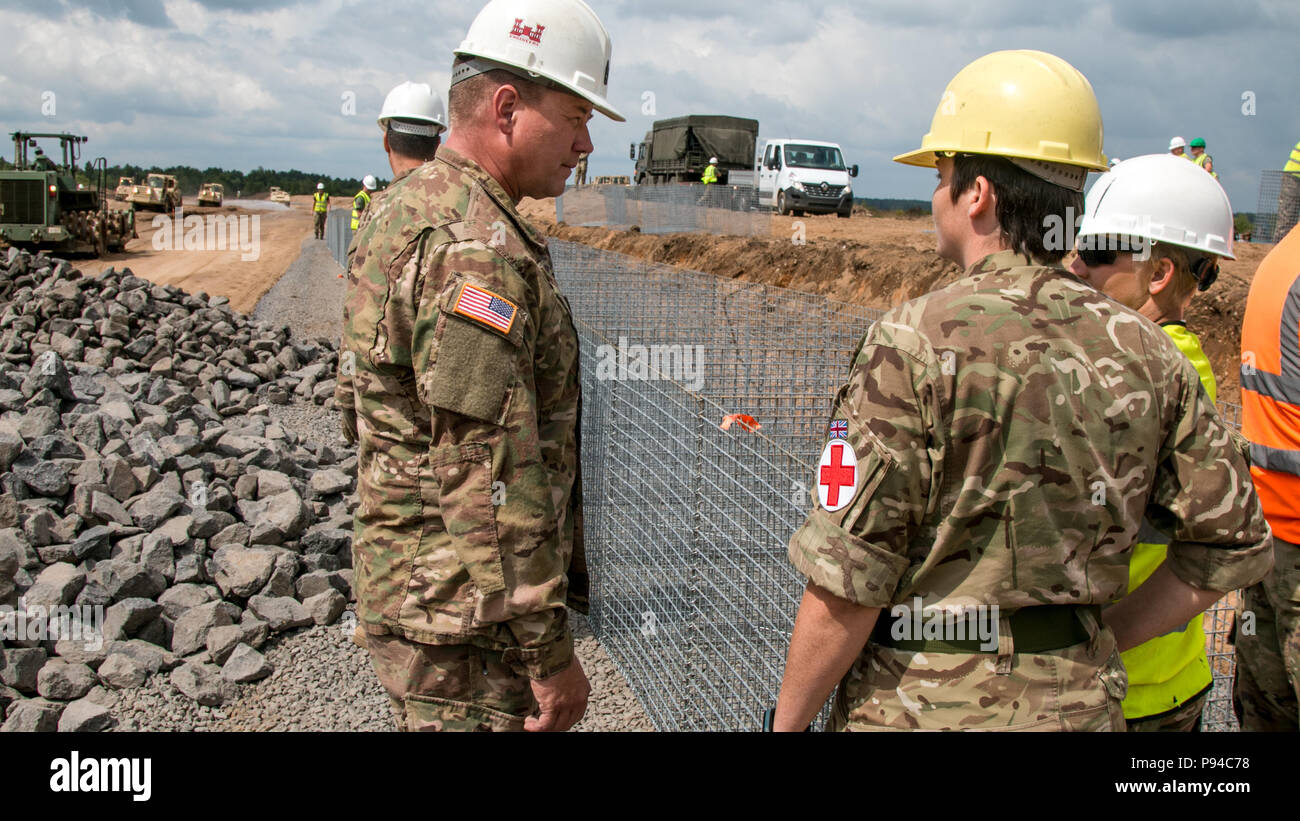 Master Sgt. Byron Smith (left) of the Michigan Army National Guard's 107th Engineer Battalion ...
