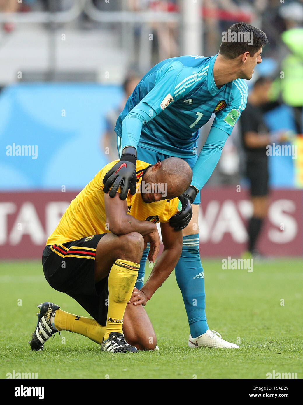 Belgium's Vincent Kompany sits in pain after picking up an eye injury ...