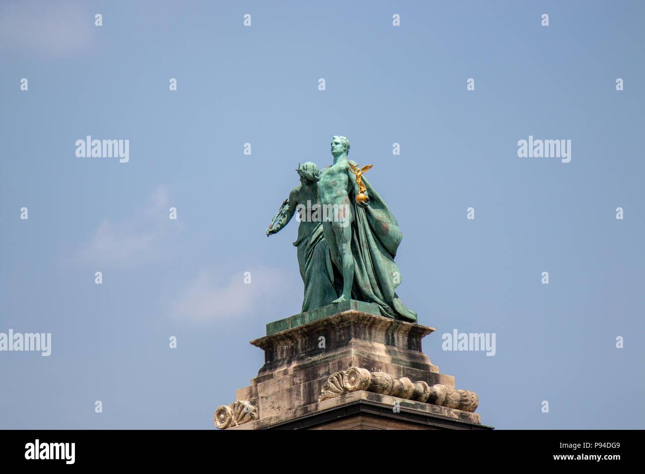 The statue of Knowledge and Glory on top of the right colonnade of the ...