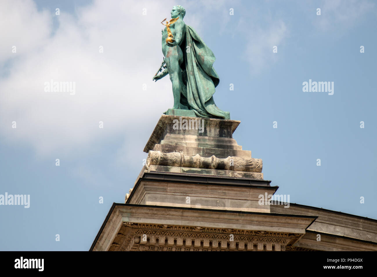 The statue of Knowledge and Glory on top of the right colonnade of the ...