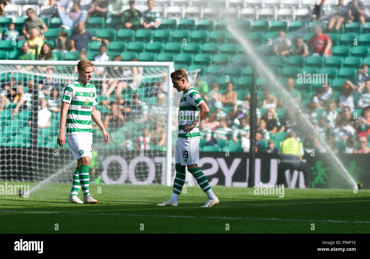 Celtic’s Stephen Welsh and Scott Allan wait for the game to restart ...