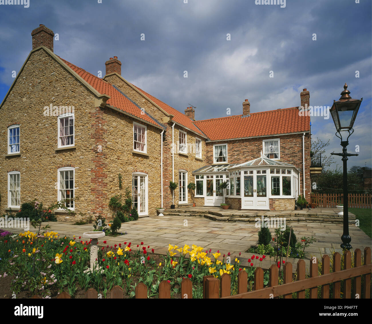 Traditional country house with extension in Spring Stock Photo - Alamy