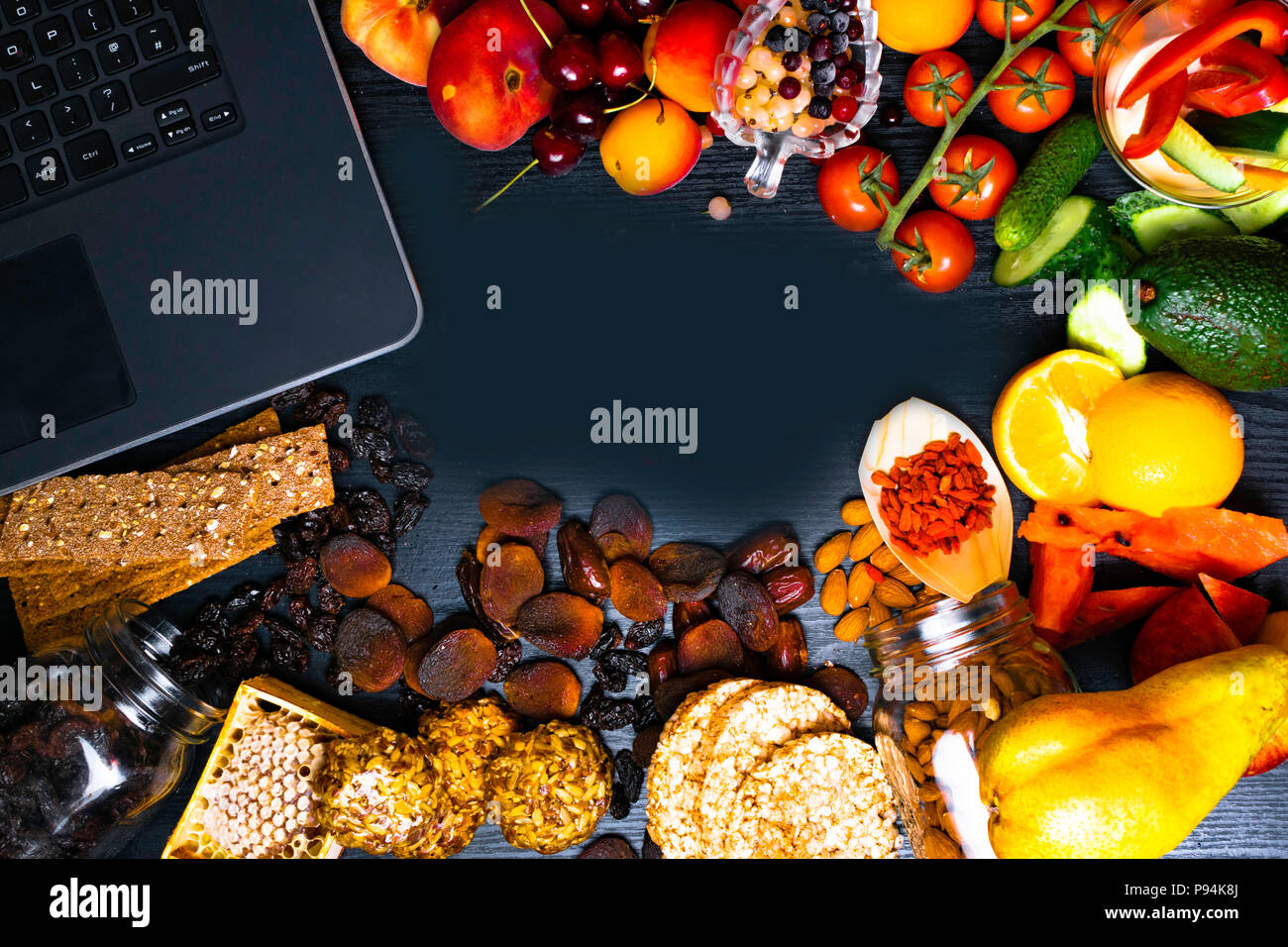 Healthy snack food on wooden table with notebook copy space, top view ...
