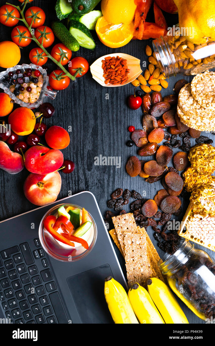 Healthy snack food on wooden table with notebook copy space, top view ...