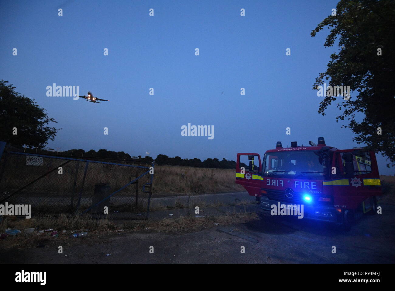 The London Fire Brigade battling a grass fire near Heathrow airport the ...