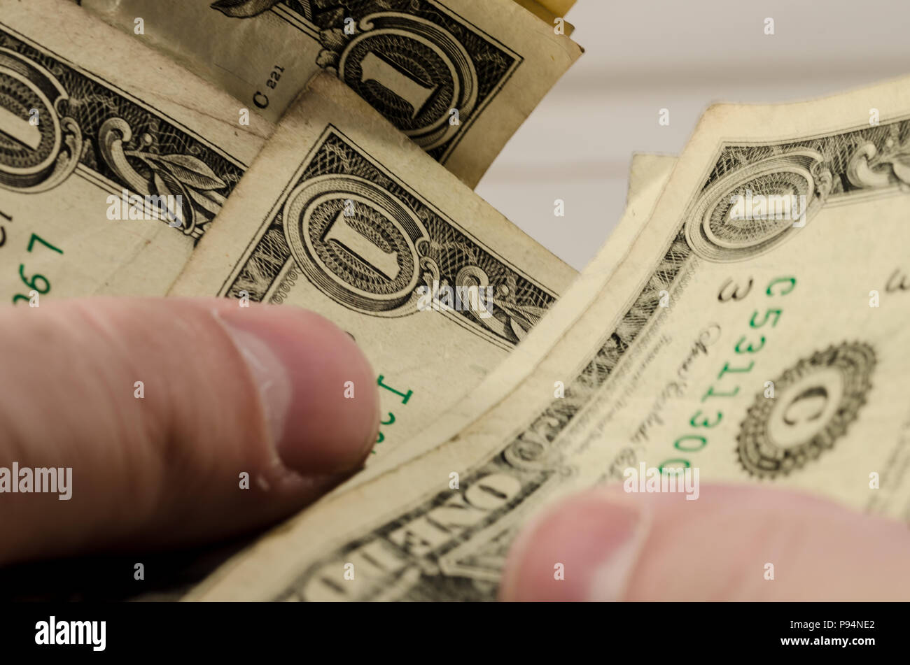 close up of human hand counting dollars Stock Photo - Alamy