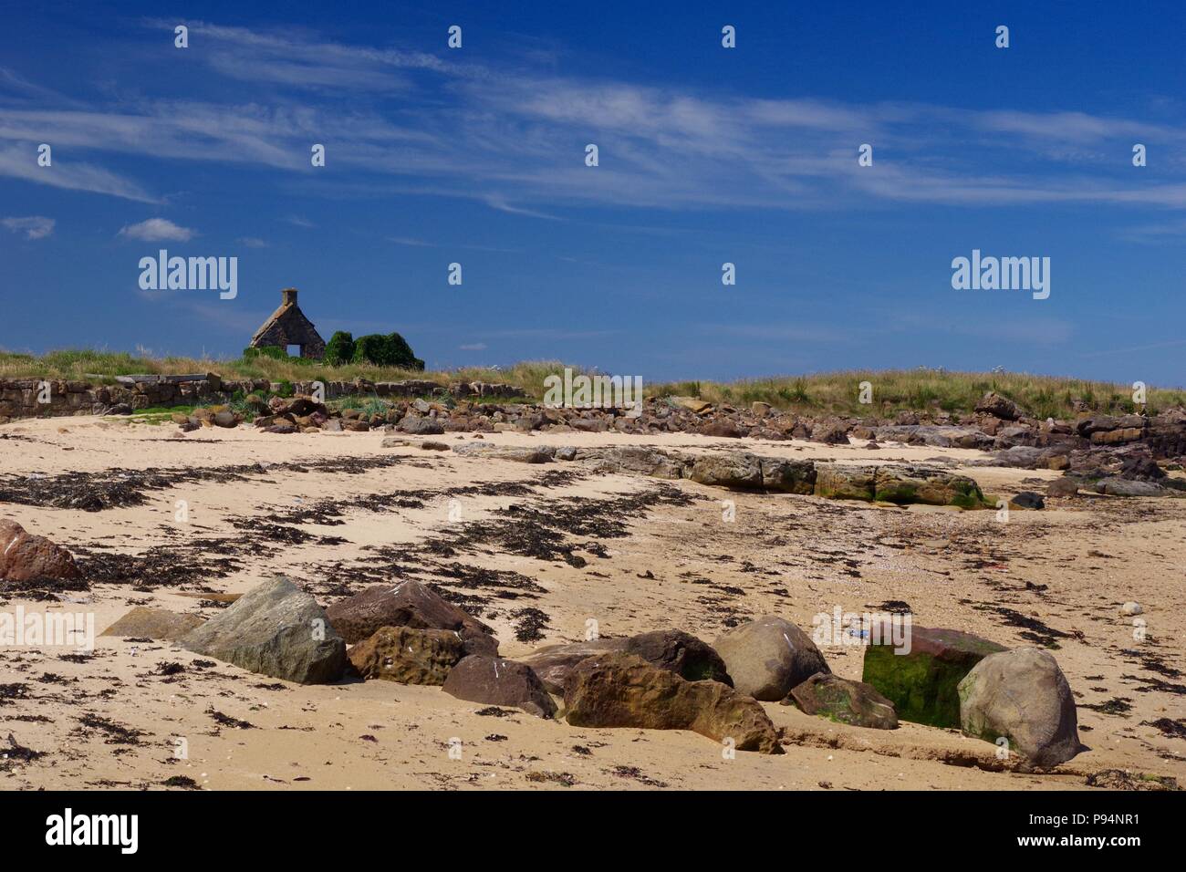 Ruined Coastal Cottage by a Remote Sandy Beach on a Sunny Summer Day ...