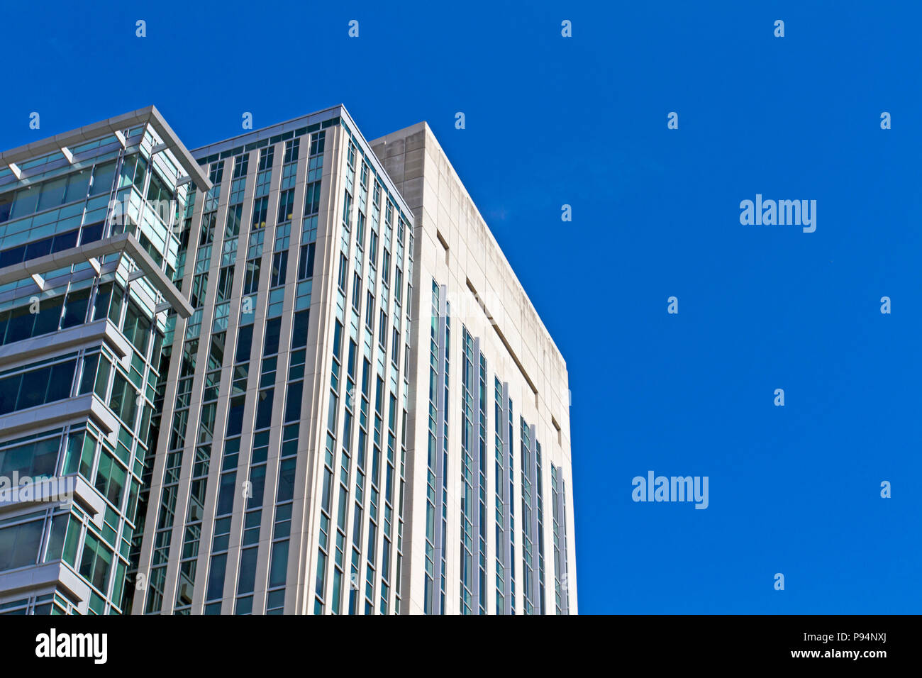 Modern skyscraper building in a city, blue sky, background Stock Photo ...