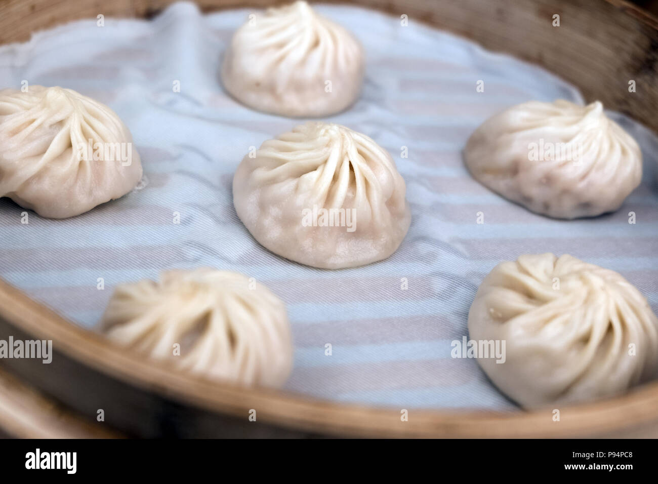 Shanghai steamed bun in small bamboo basket Stock Photo - Alamy