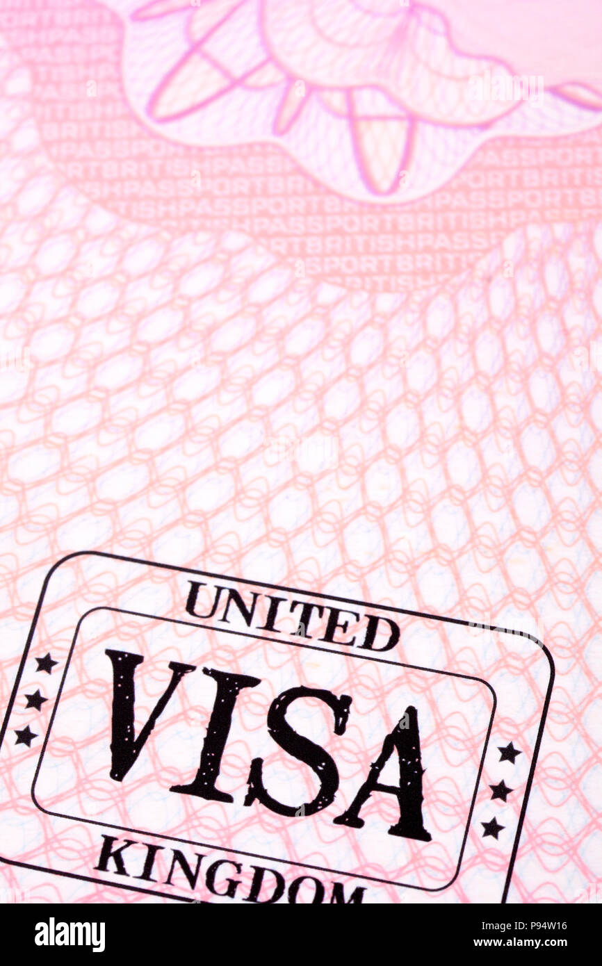 UK visa immigration stamp passport page close up, copy space, vertical ...