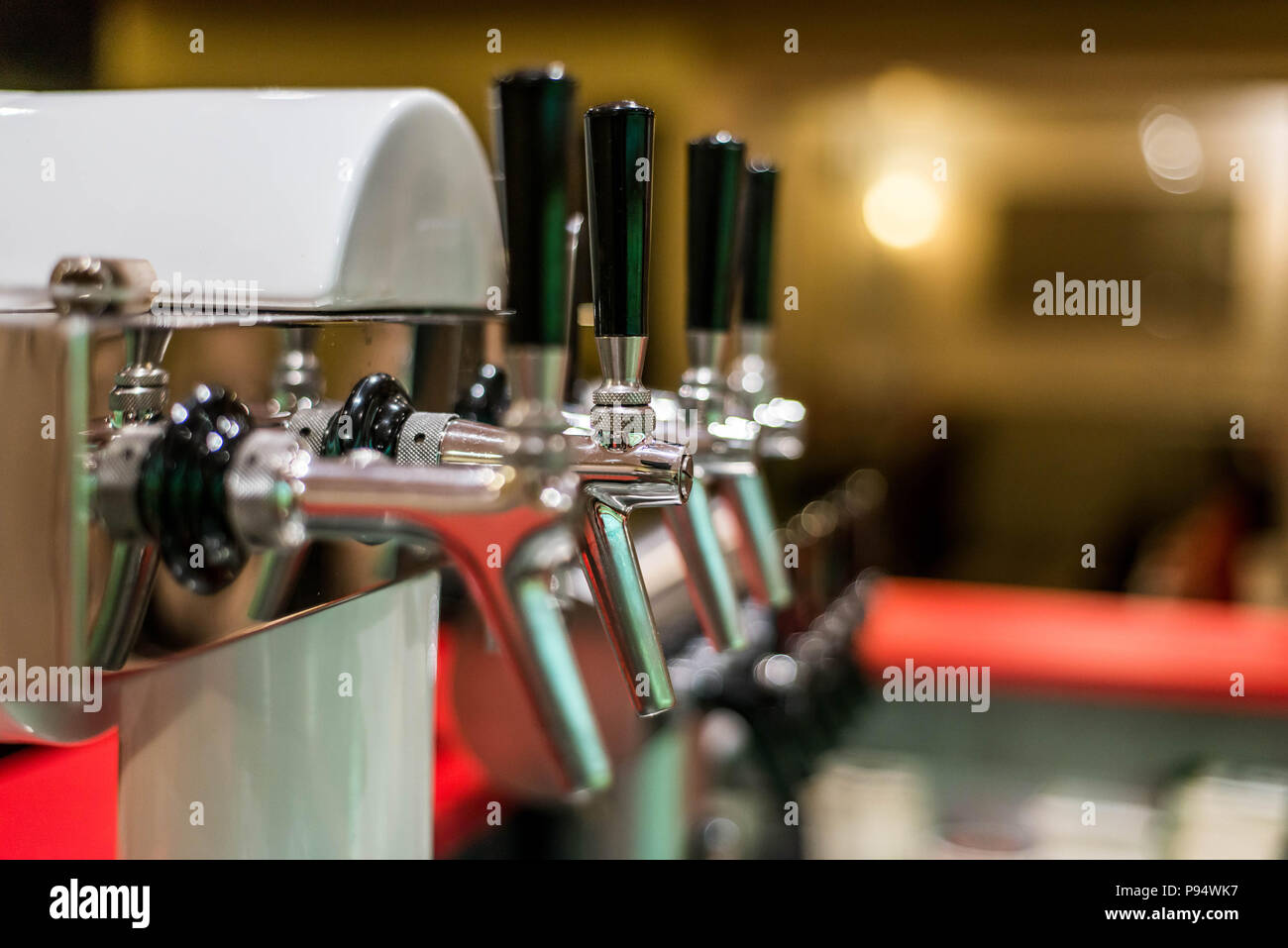 close up draft beer and lemonade dispensing tower of a bar restaurant ...