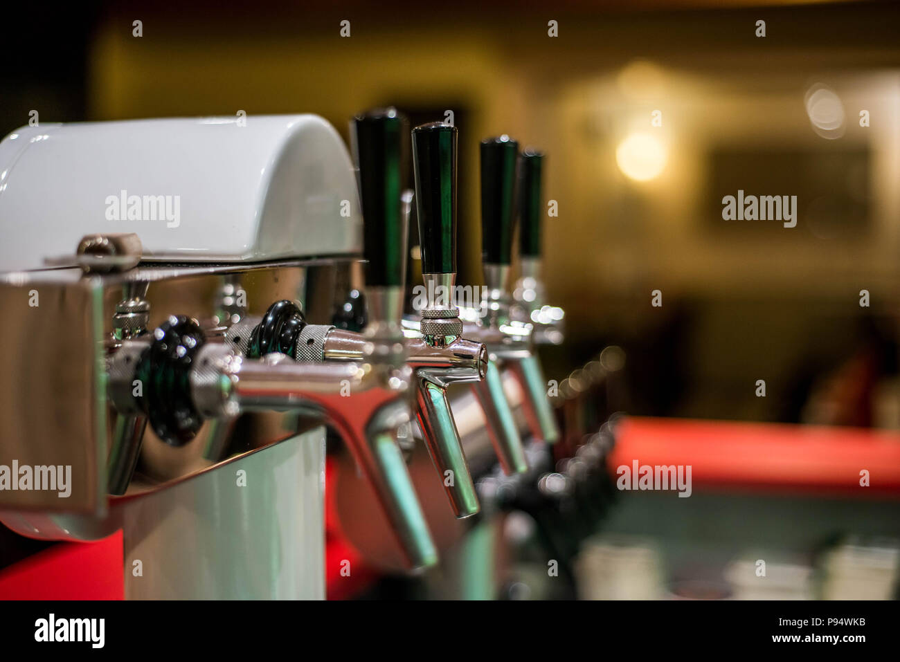 close up draft beer and lemonade dispensing tower of a bar restaurant ...