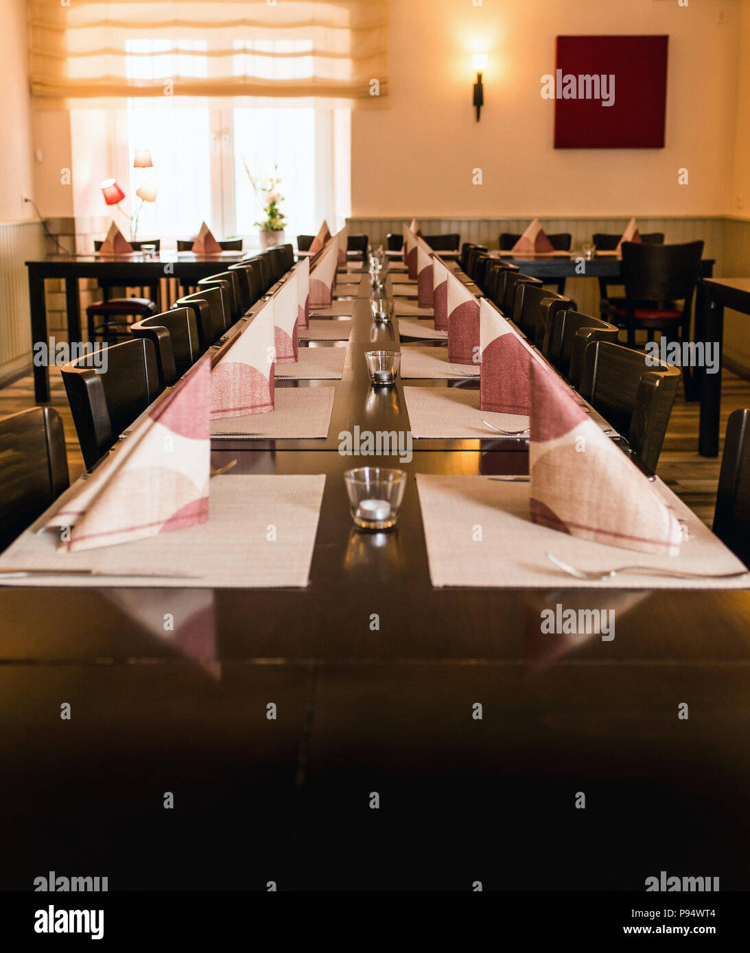 Long lunch table at restaurant hi-res stock photography and images - Alamy