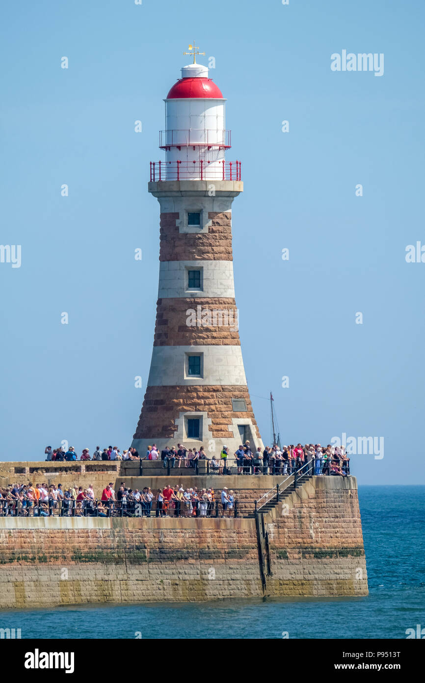 Sunderland, UK. 14th July 2018. Spectators sitting on Roker Lighthouse ...