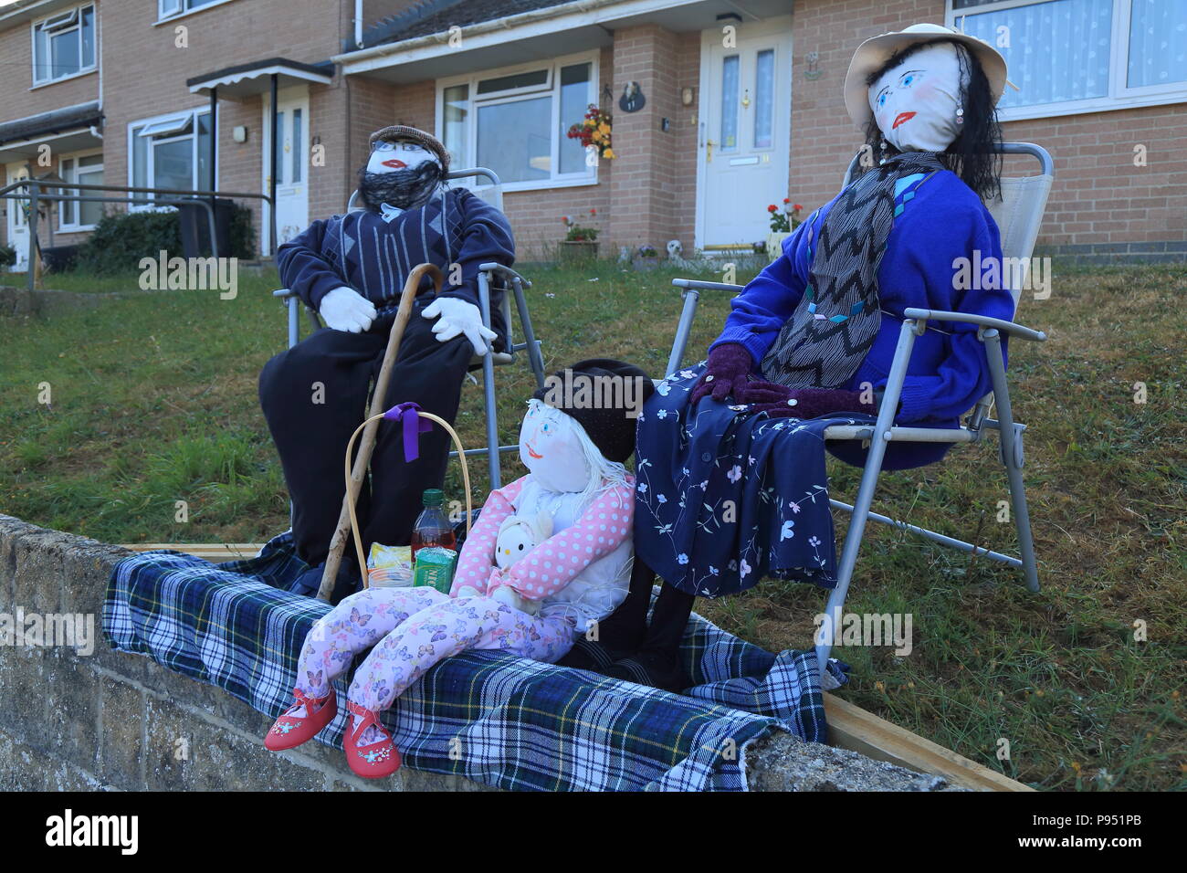 Musbury, UK, 14th July, 2018. Straw-filled frighteners around the ...