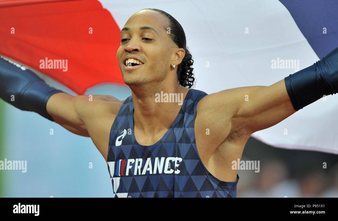 Pascal Martinot-Lagarde (FRA) with the French flag in the mens 110m ...