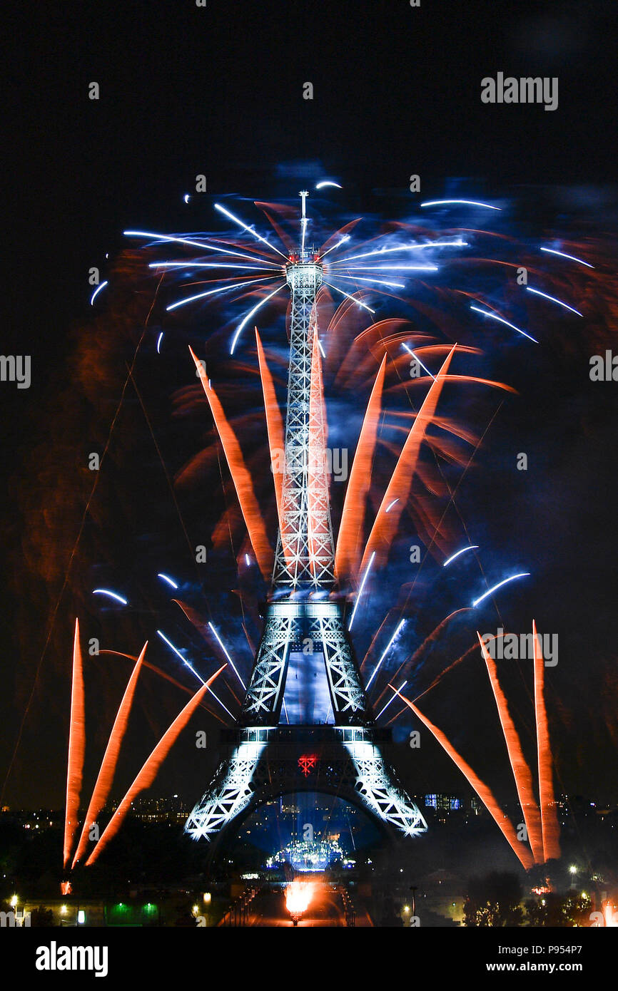 Paris, France. 14th July, 2018. Fireworks explode near the Eiffel Tower during the Bastille Day ...