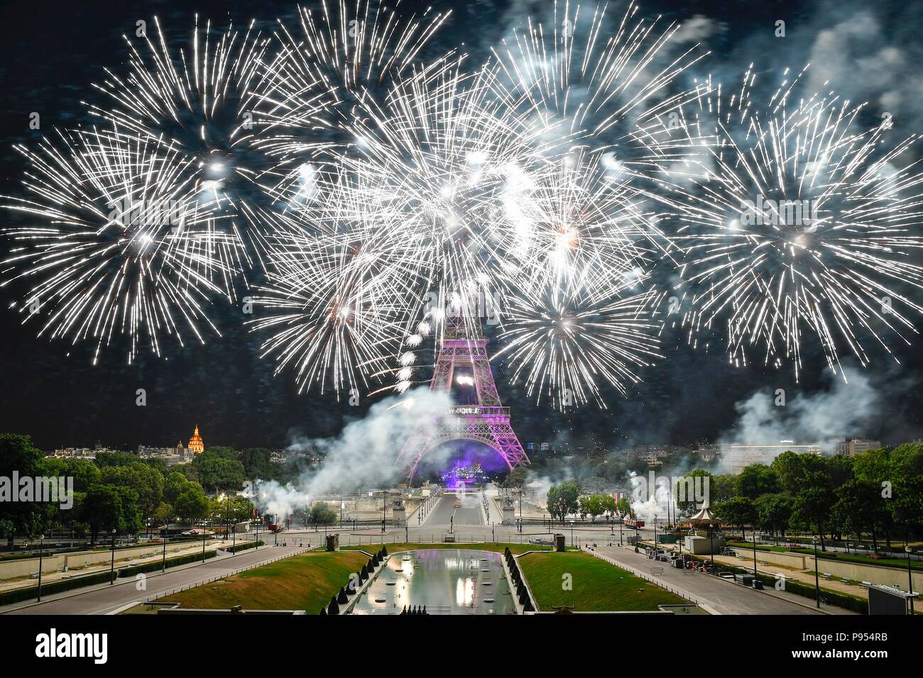 Paris, France. 14th July, 2018. Fireworks explode near the Eiffel Tower ...