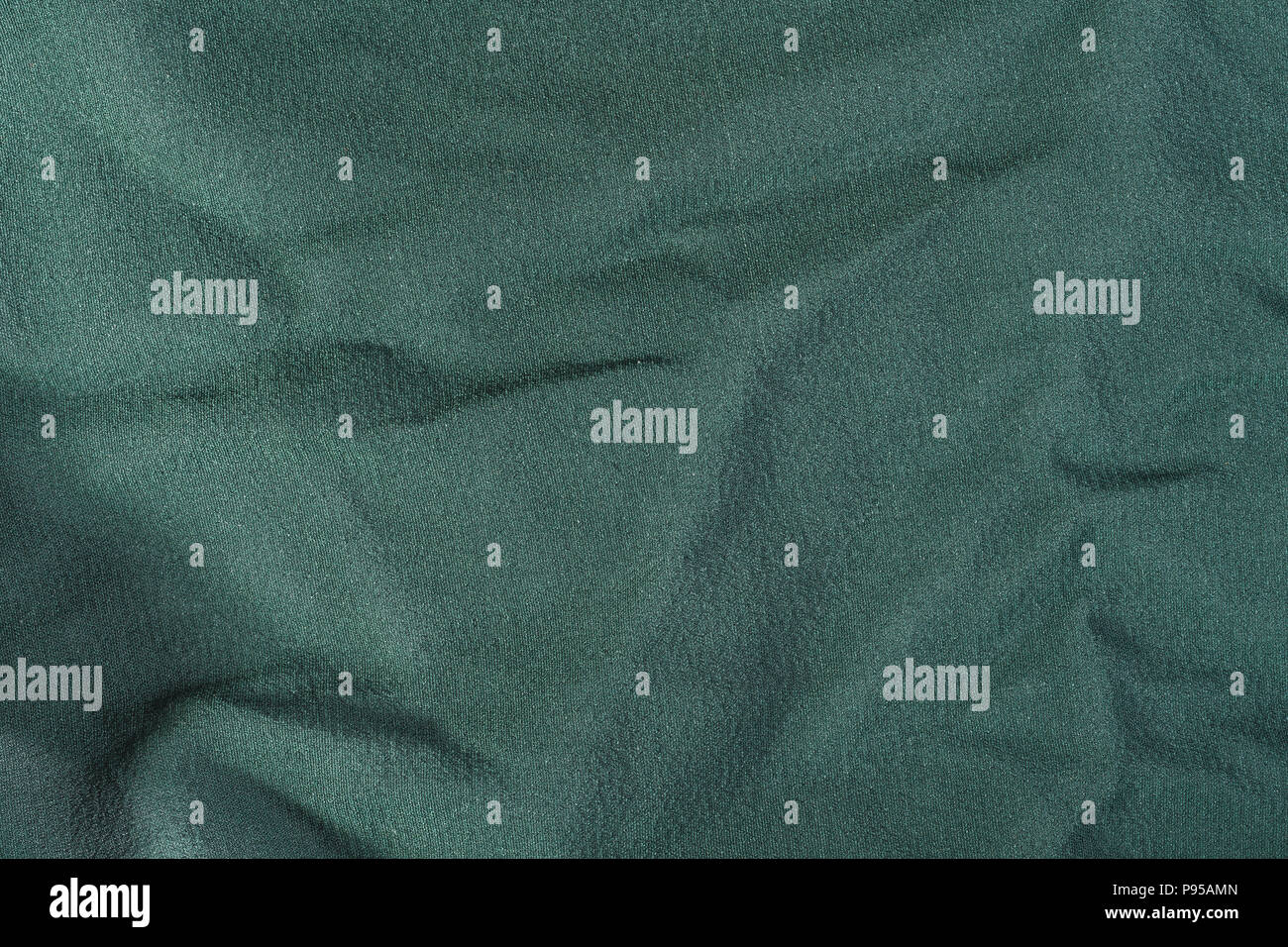 Green wrinkled fabric texture. Closeup Stock Photo - Alamy