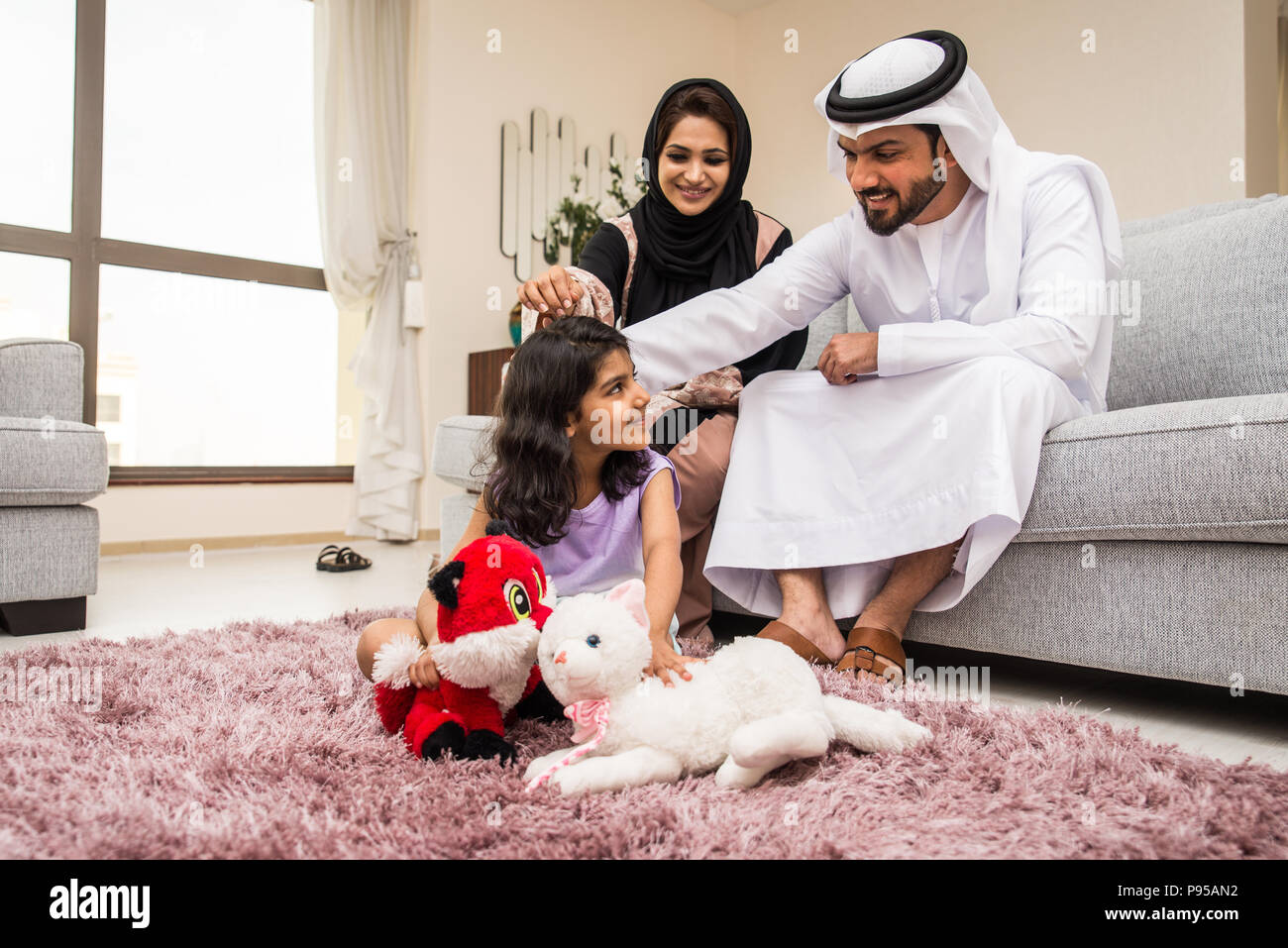 Happy arabian family having fun at home Stock Photo - Alamy