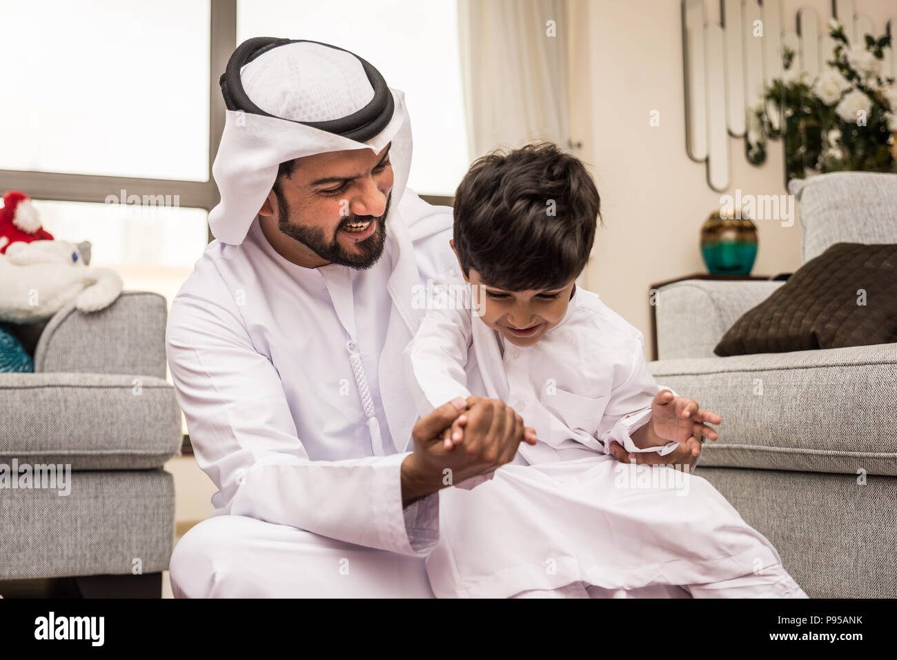 Happy arabian family having fun at home Stock Photo - Alamy